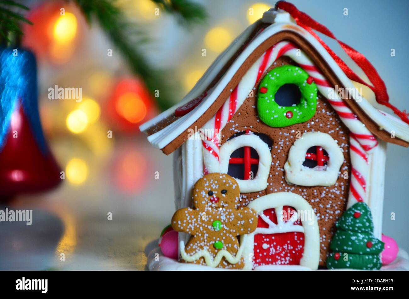 Christmas gingerbread house decoration on background of defocused ...