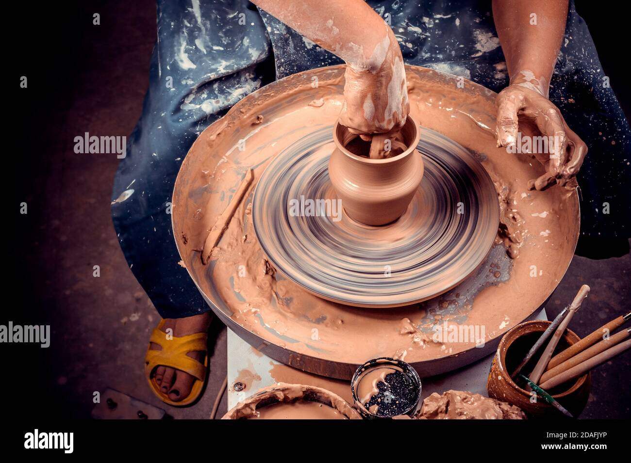 hands of potter do a clay pot Stock Photo - Alamy