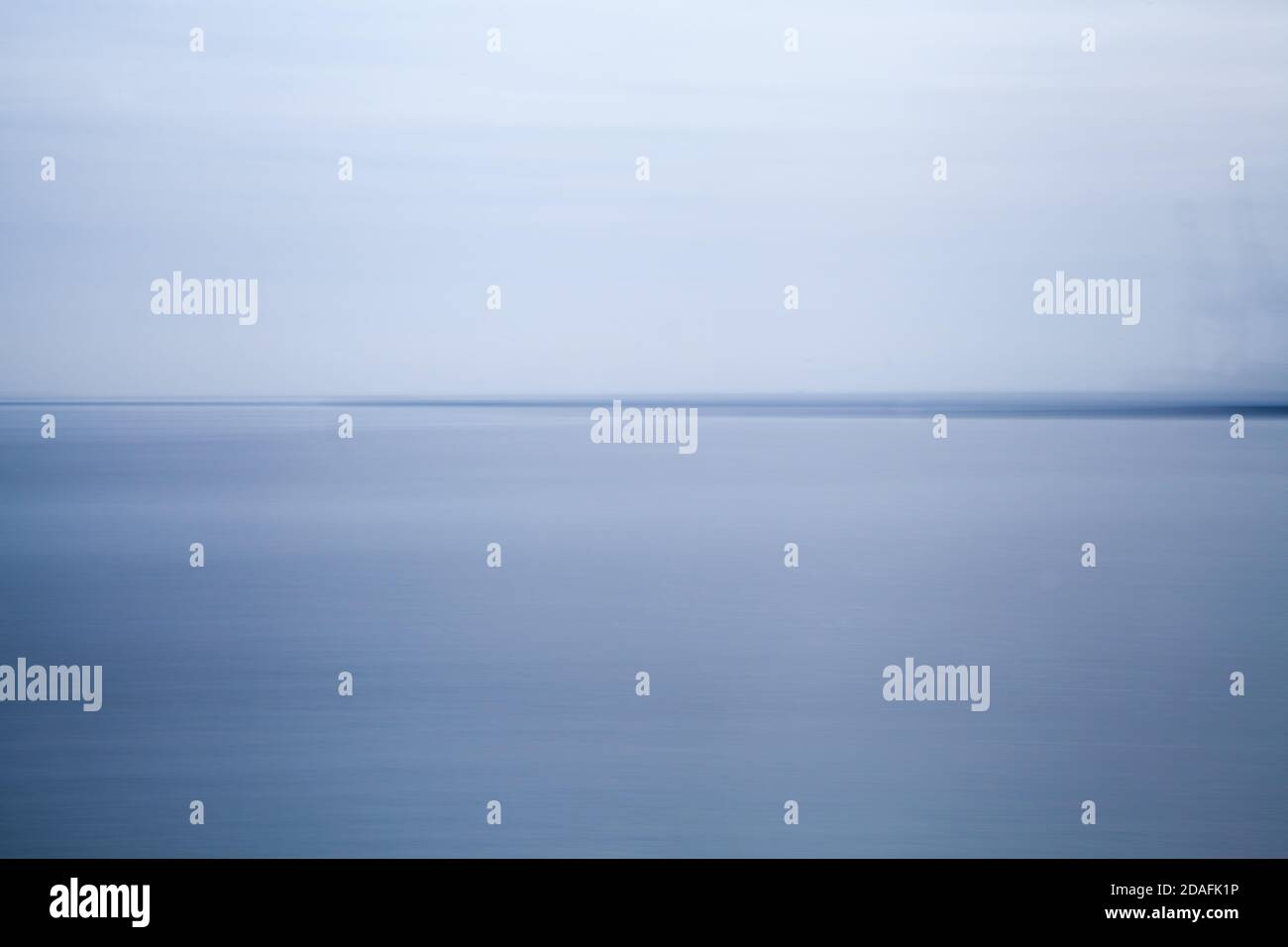 Where the sky meets the sea, blue hazy abstract image Stock Photo - Alamy