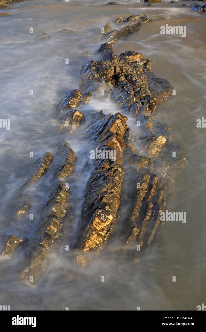 Rock ledges in the sea at Duckpool in Cornwall Stock Photo - Alamy
