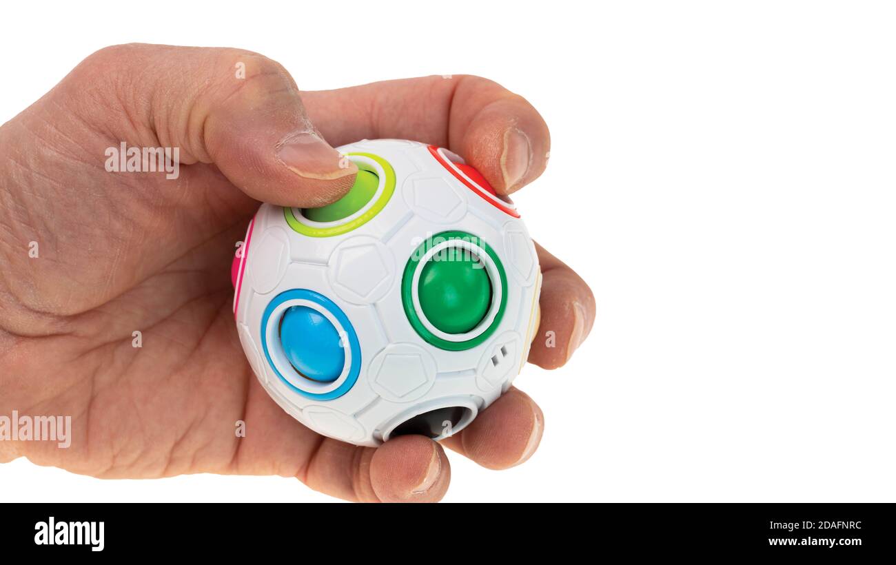 Close up view of colorful anti stress toy in man's hand. Stress and ...