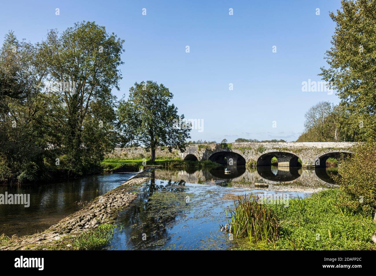 Nine arch, five arch, offset bridge over the Kings river and stone weir ...