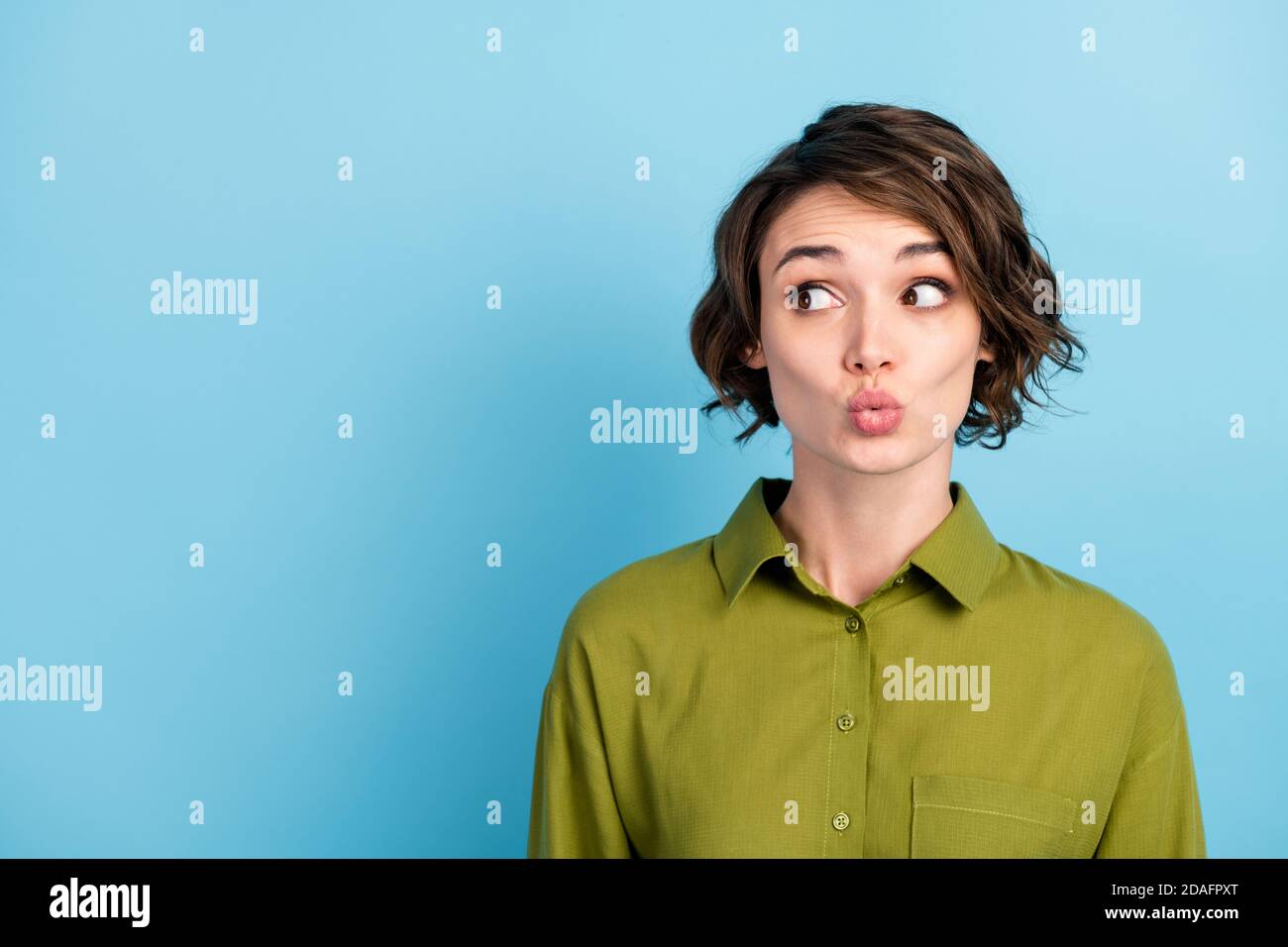 Photo portrait of pretty young shy girl looking at side sending air ...