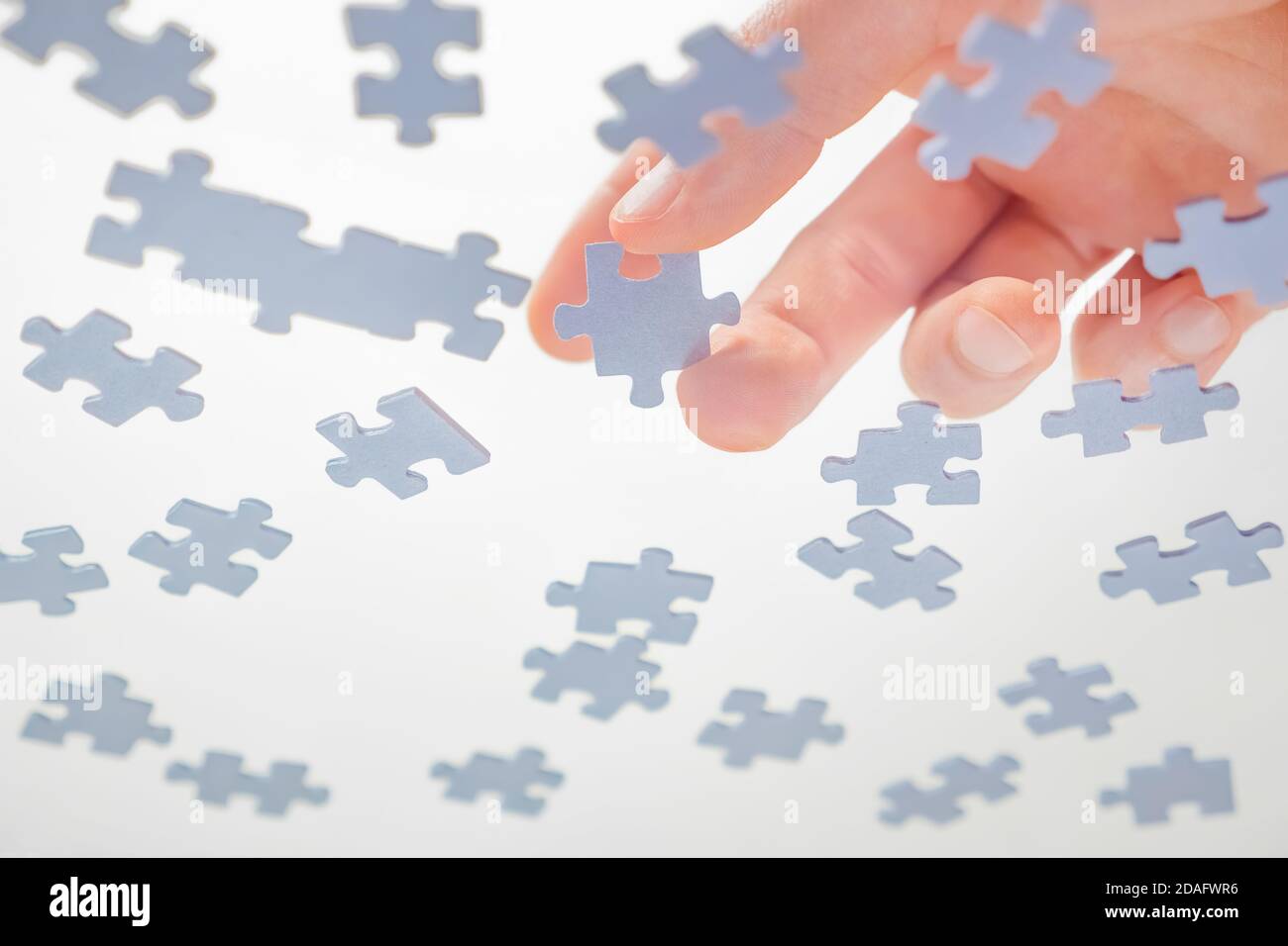 Bottom View. Male Hands Assembling Jigsaw Puzzle. Pastime, a hobby ...