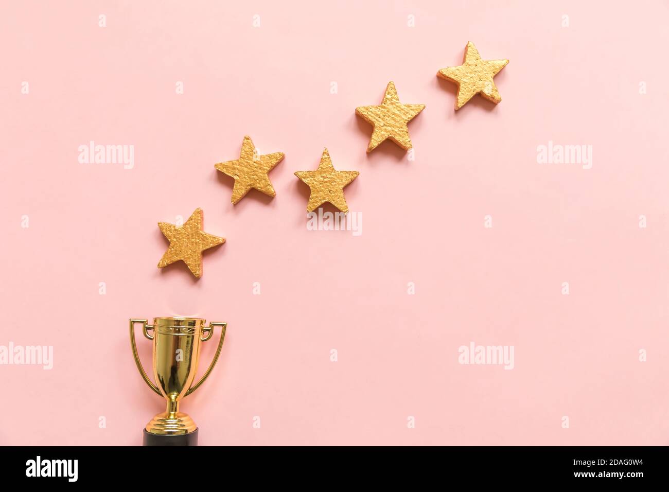 Simply flat lay design winner or champion gold trophy cup and 5 stars ...