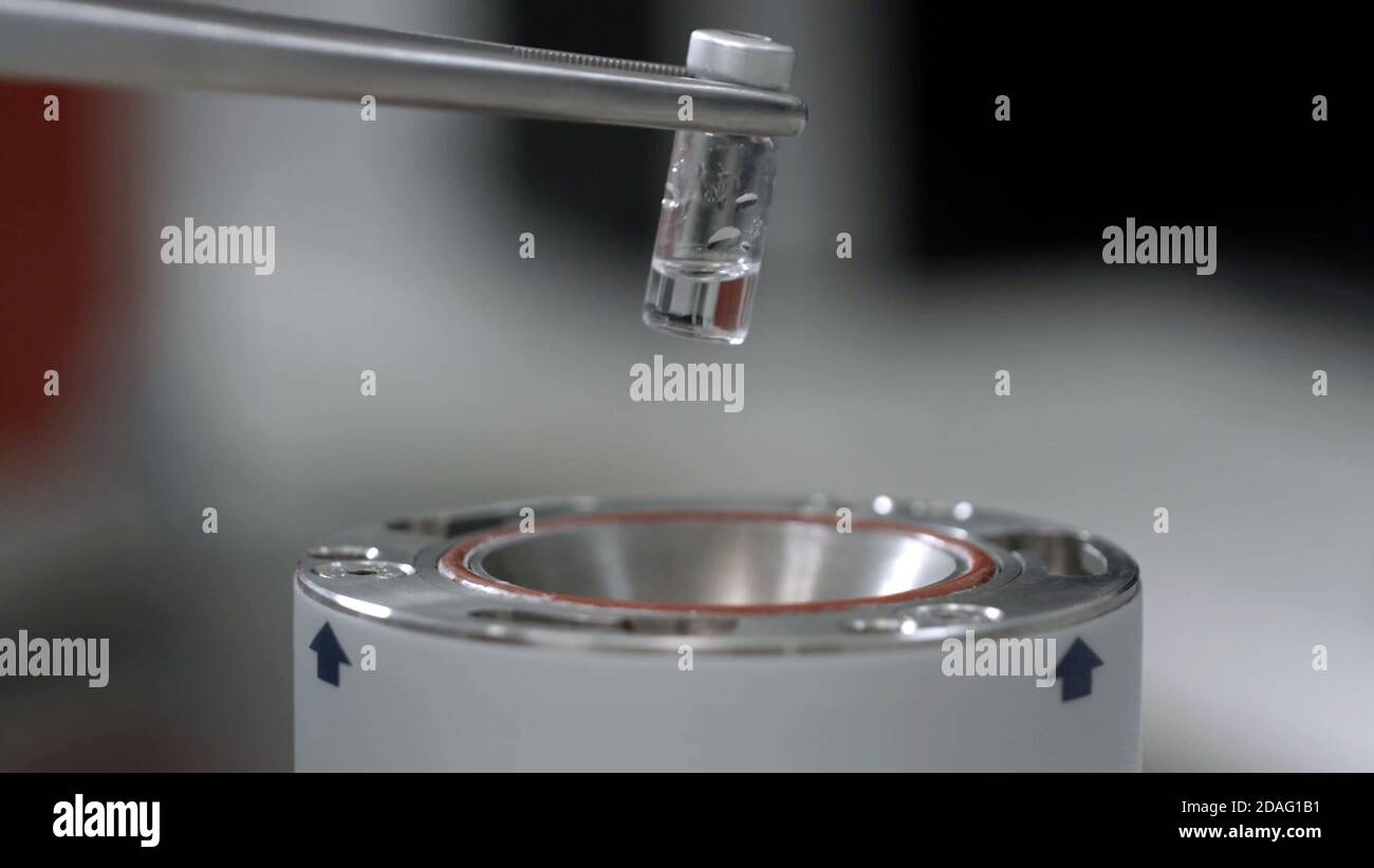 add glass capsule sample to centrifuge in the laboratory, selective ...