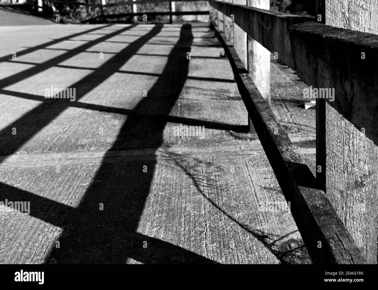 A pattern of shadows cast by bridge railings Stock Photo - Alamy