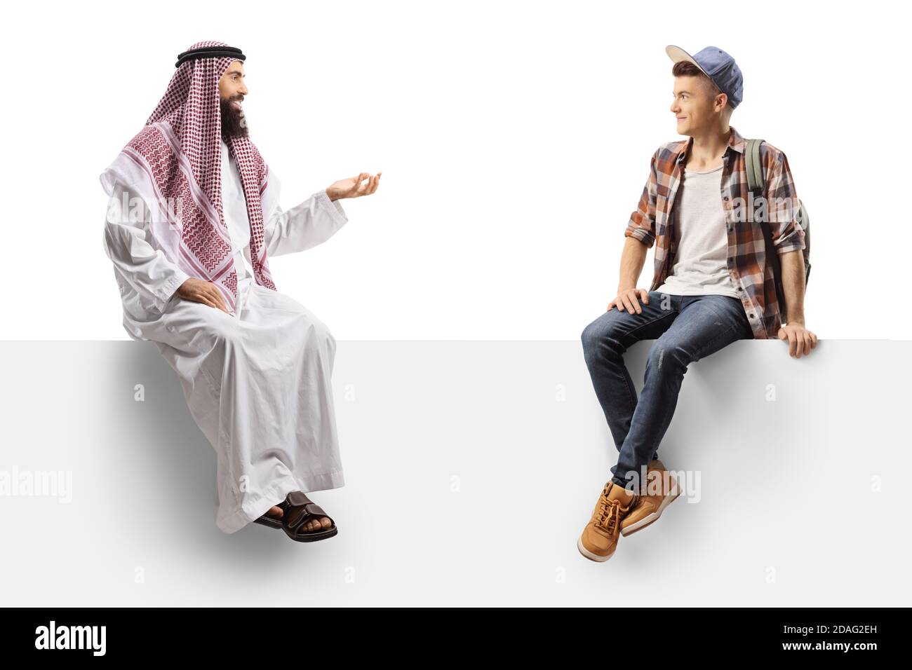 Saudi arab man and a male student sitting on a panel and talking ...