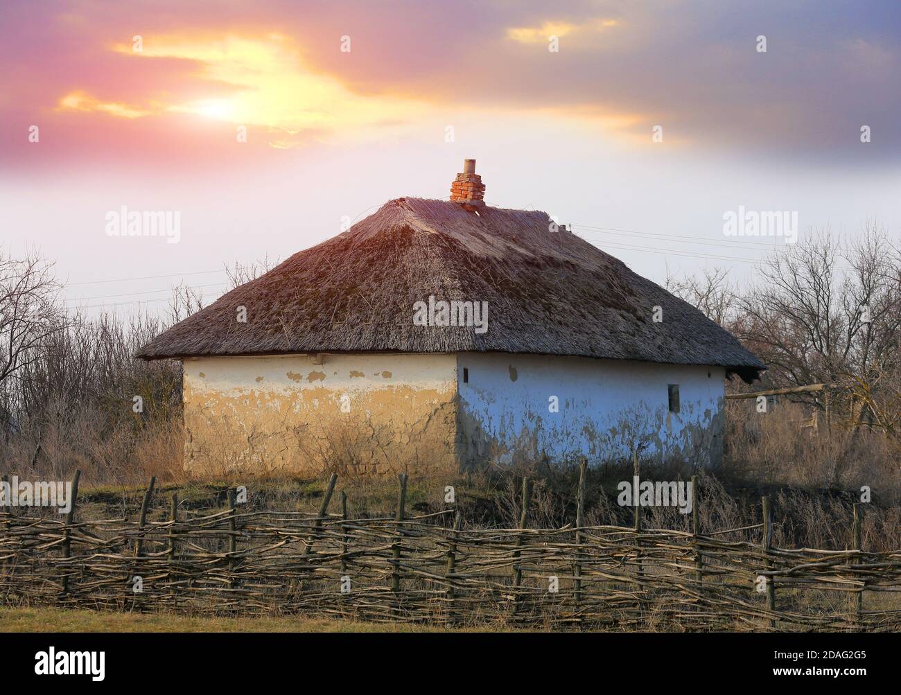 Abstract traditional ukrainian clay hut with a reed roof in autumn ...