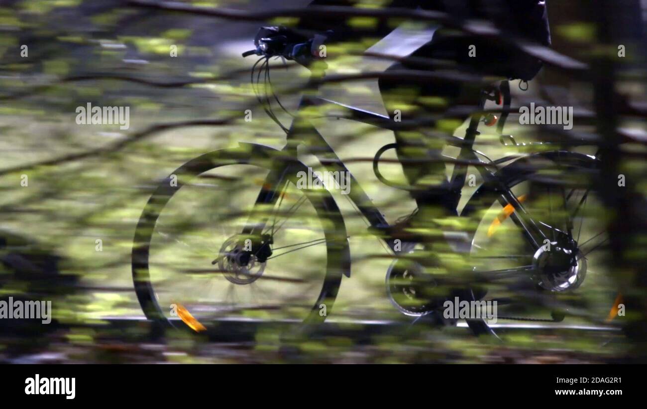 motion blur effect while riding a bicycle in park background Stock ...