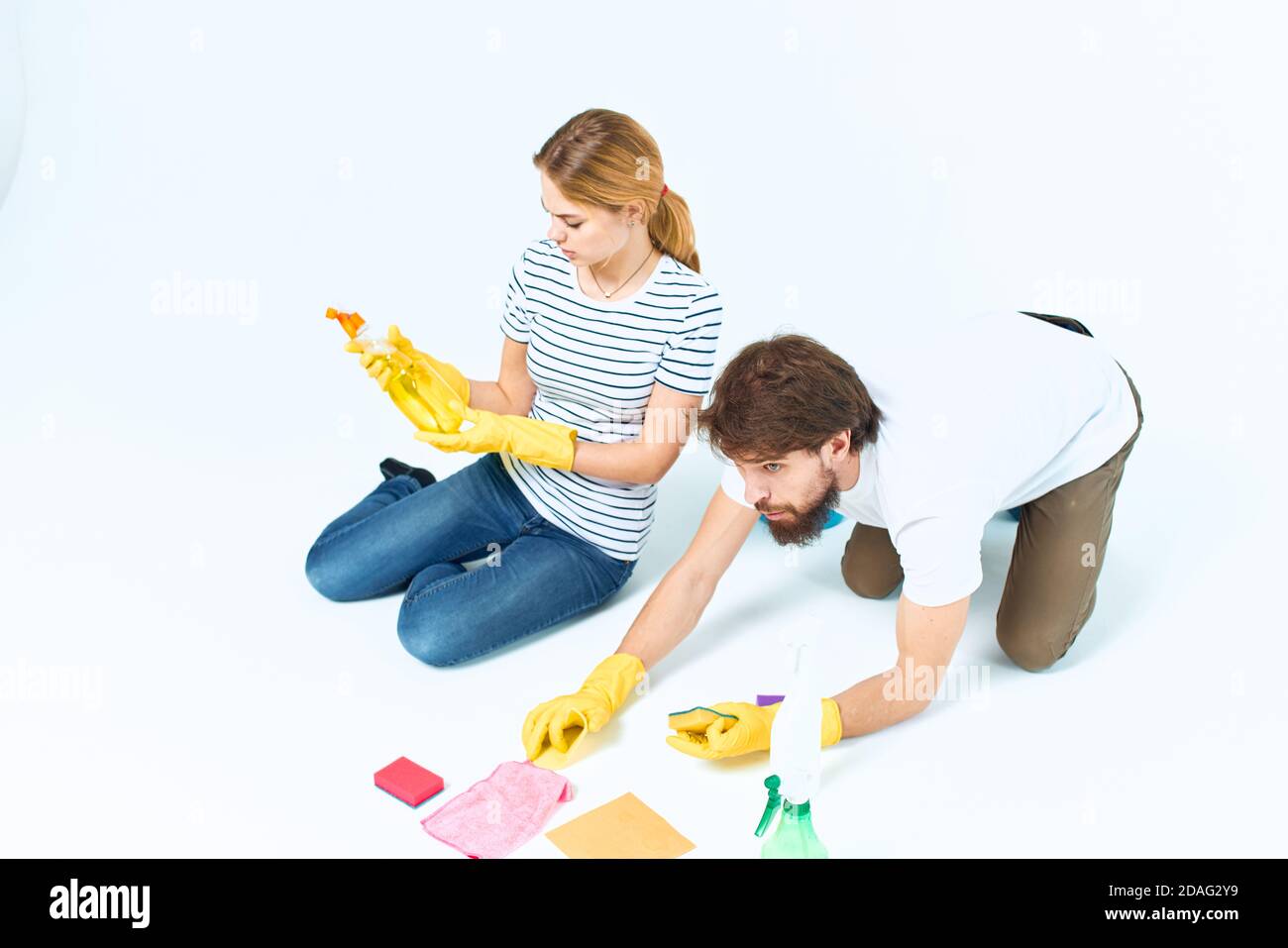 Man and woman detergent lifestyle cleaning teamwork Stock Photo - Alamy