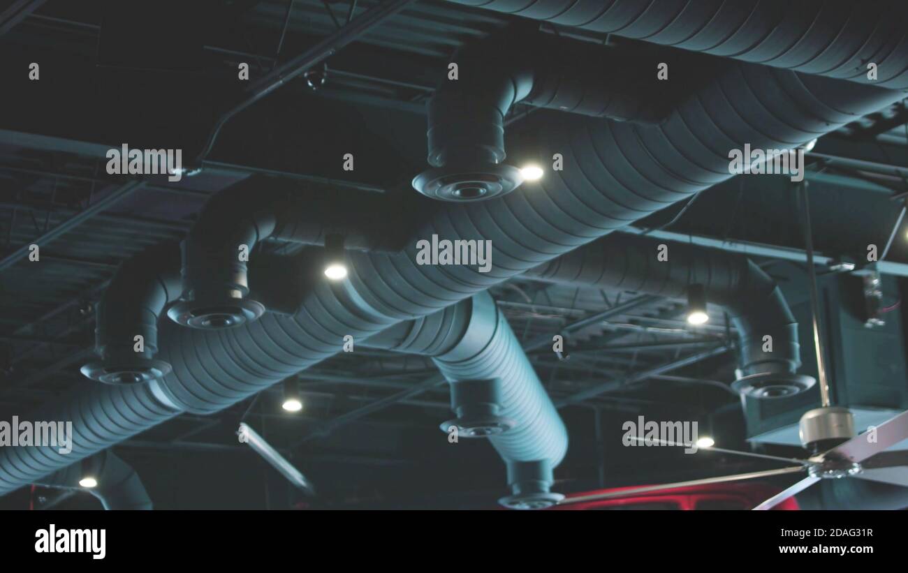 industrial tubes of air conditioning system in the roof of a building ...