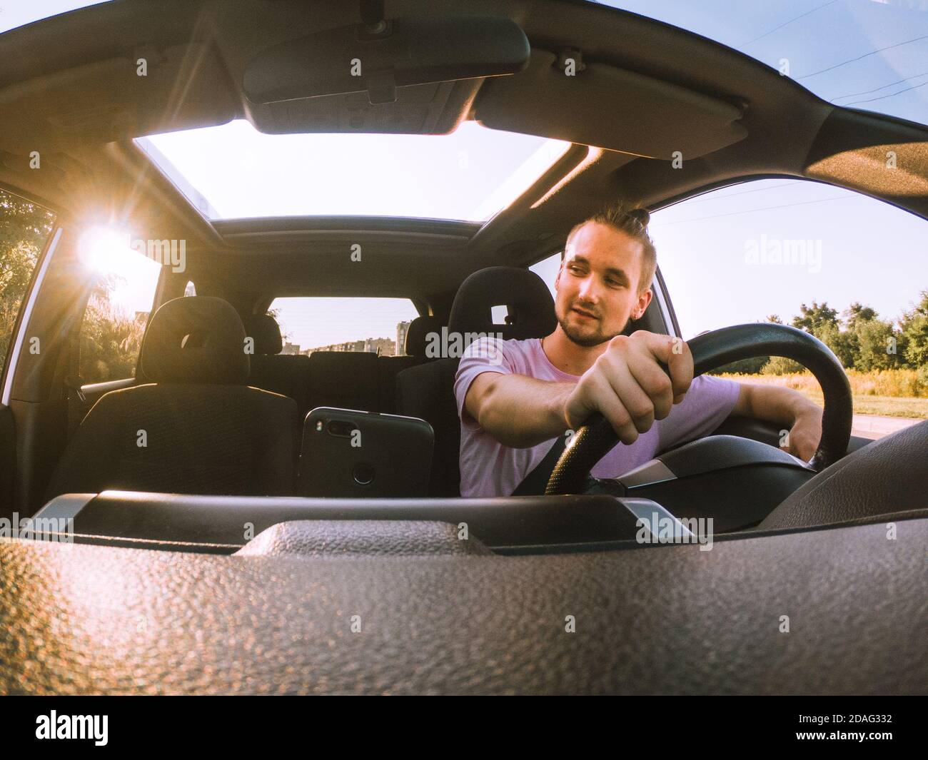 man sitting inside the car driving Stock Photo - Alamy