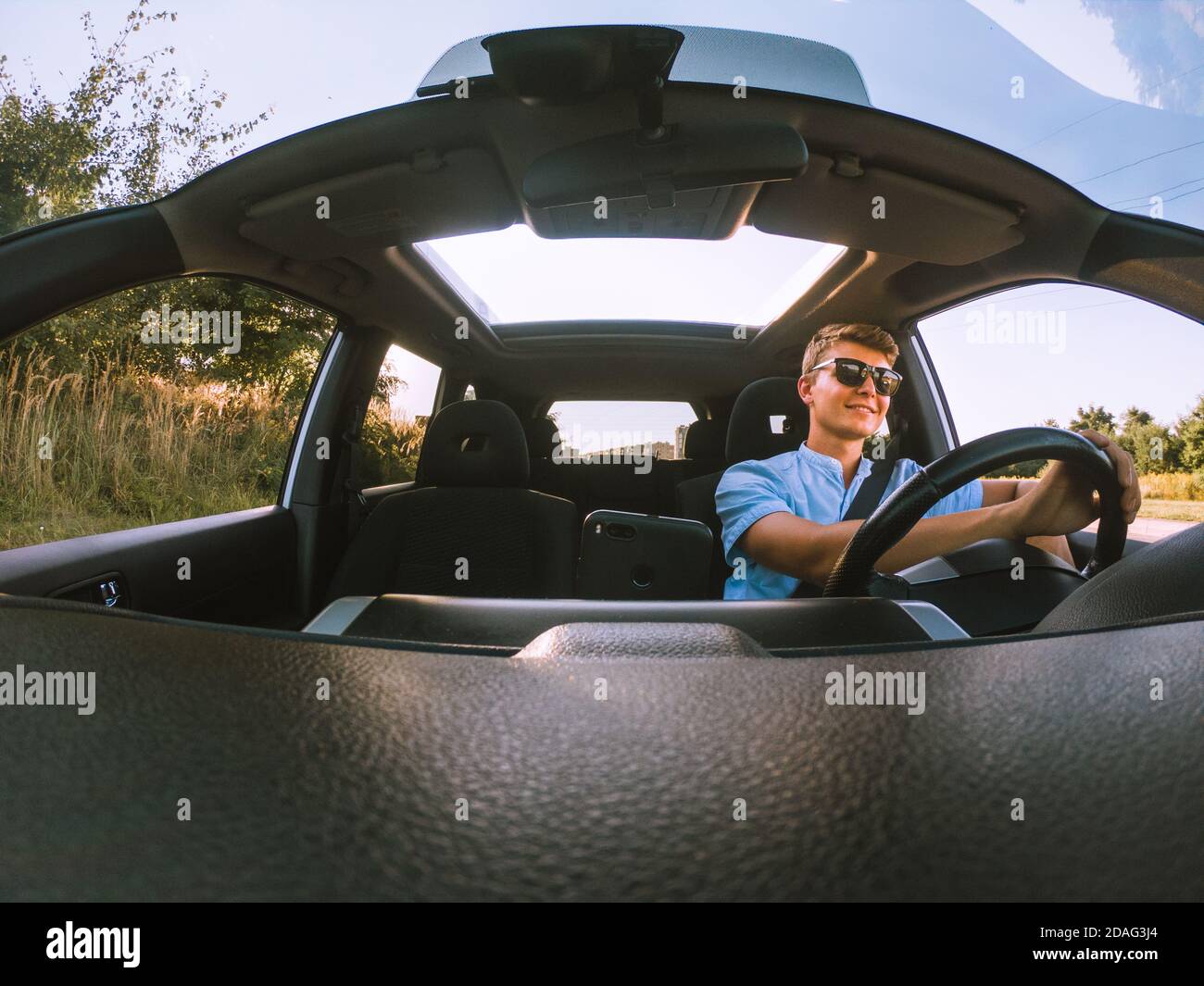 man sitting inside the car driving Stock Photo - Alamy