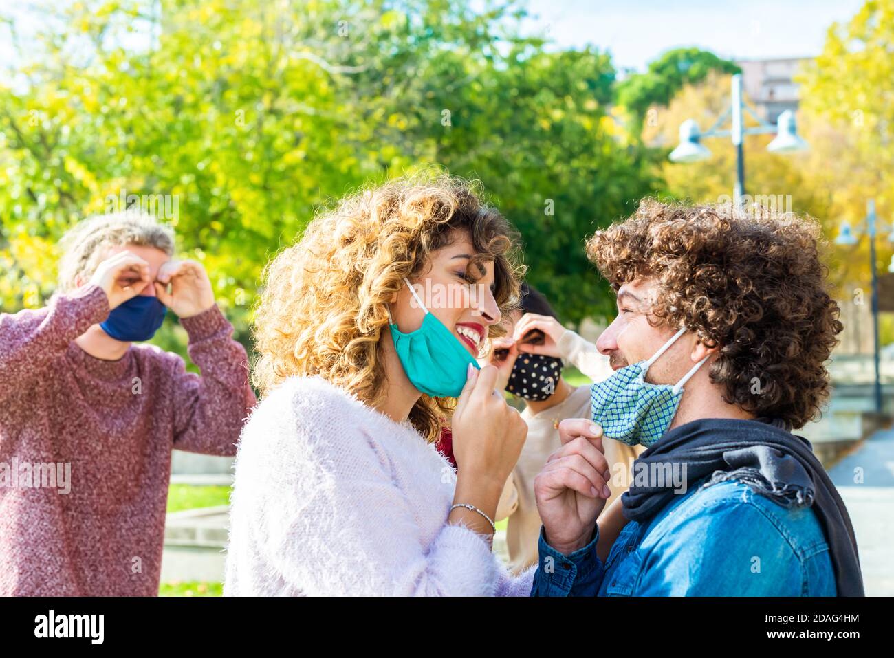 Young people having fun around city park during coronavirus outbreak ...