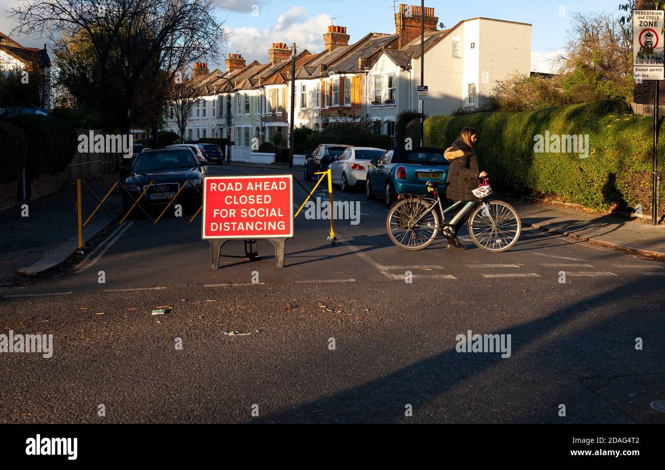 ‘Road ahead closed for social distancing’ traffic sign in a residential ...