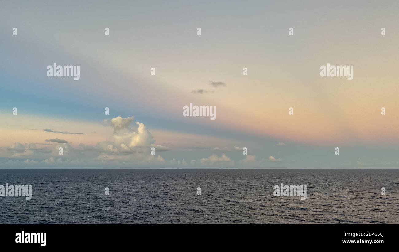 Hazy sunset over water hi-res stock photography and images - Alamy