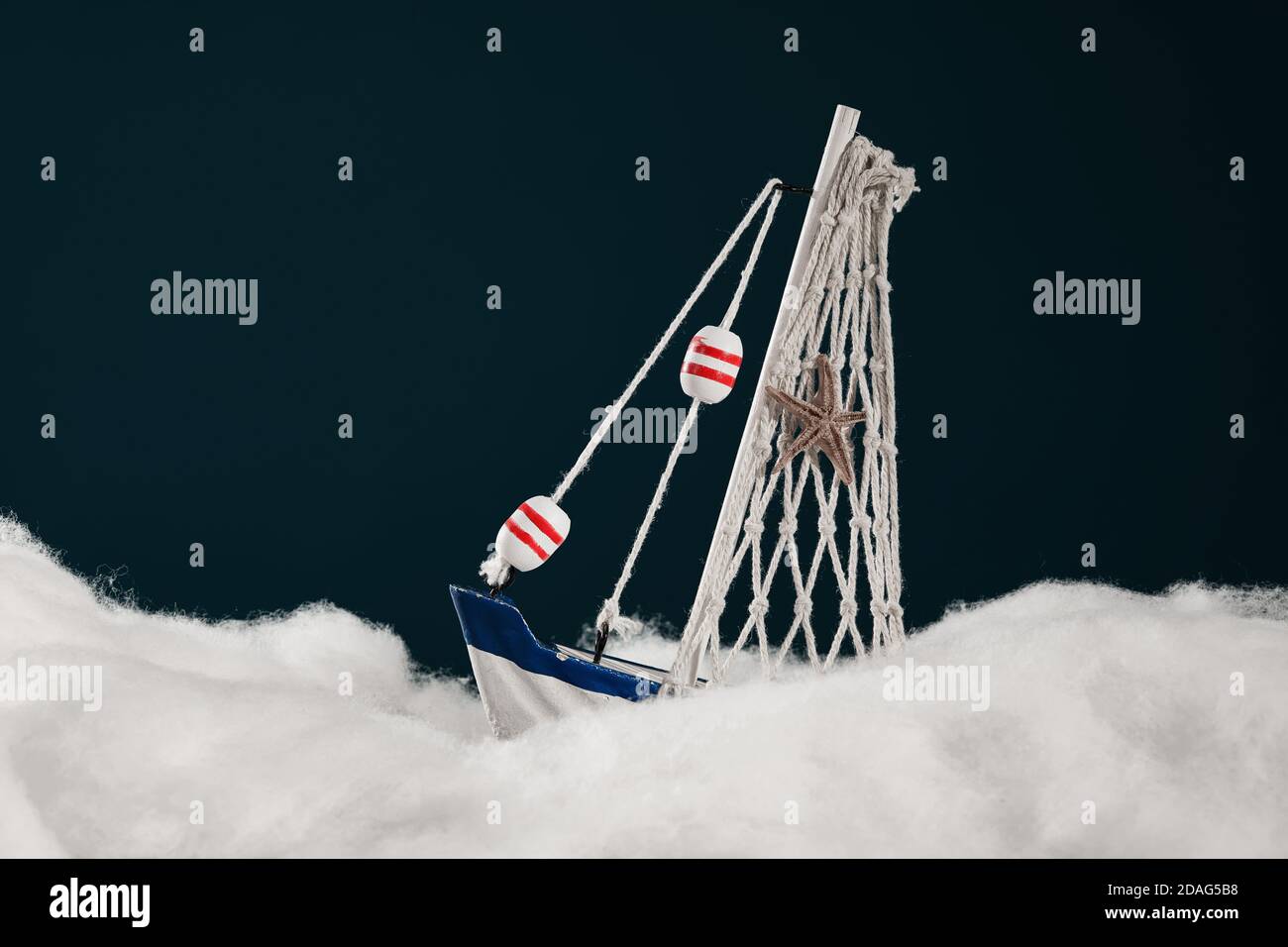 Handmade miniature ship floating on the cotton Stock Photo - Alamy