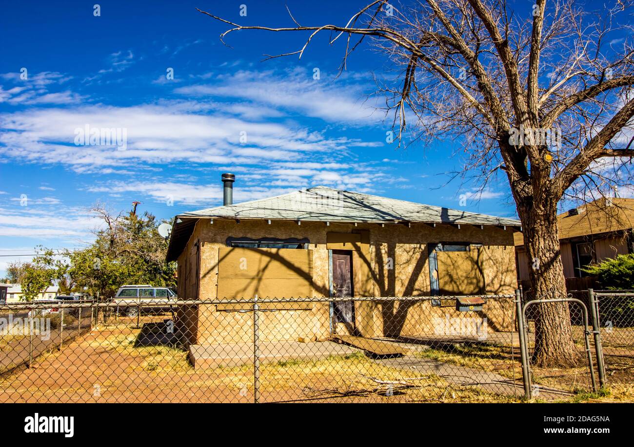 Small Abandoned One Story Home With Boarded Up Windows & Door Stock Photo - Alamy