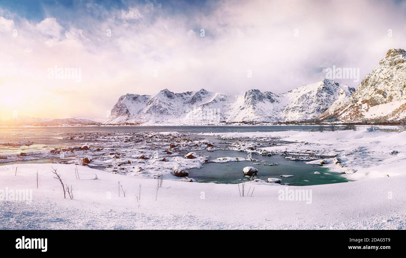 Winter scenery with frozen fjord on Vestvagoy island with snowy ...