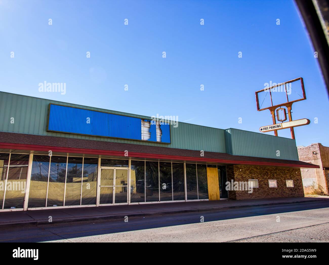 Abandoned Store Front Building With Broken Signs Stock Photo - Alamy