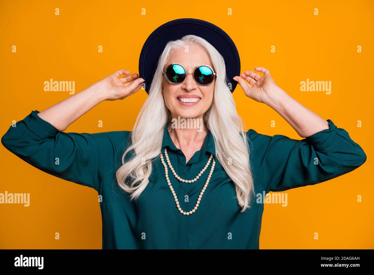 Photo of pretty cheerful white haired grandma lady senior party active ...