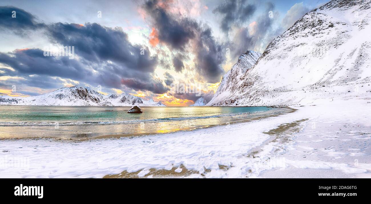 Splendid winter scenery with Haukland beach during sunset and snowy ...