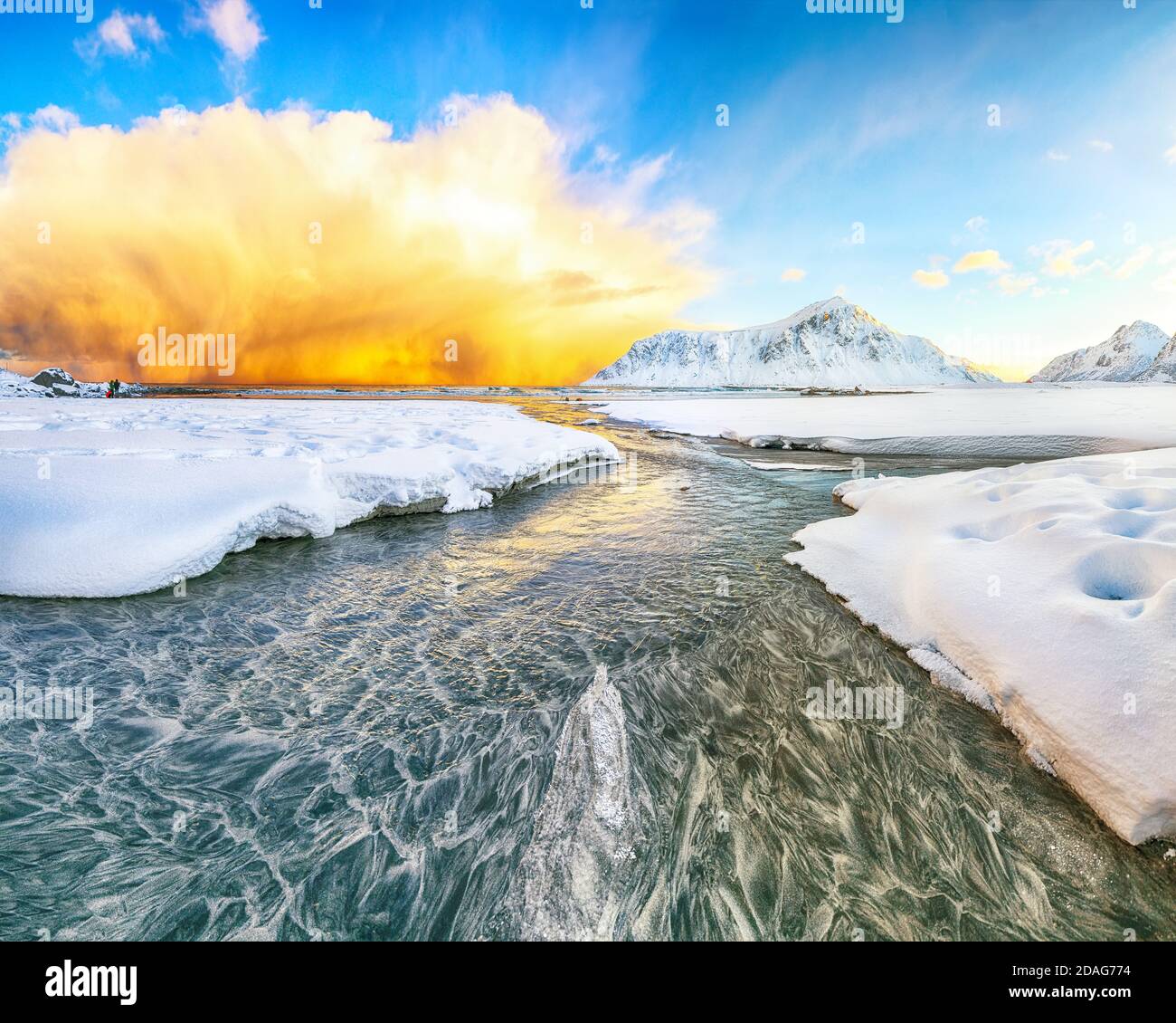 Outstanding winter scenery on Skagsanden beach with illuminated clouds during sunrise. Popular ...