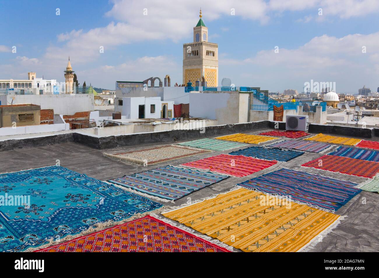 Drying rugs on the roof in the old medina, Al-Zaytuna Mosque in the ...