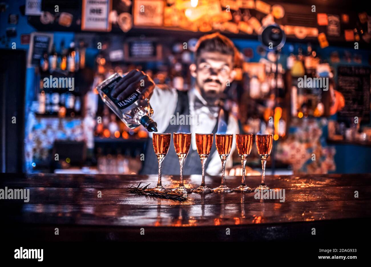 Professional barman demonstrates his professional skills at the ...