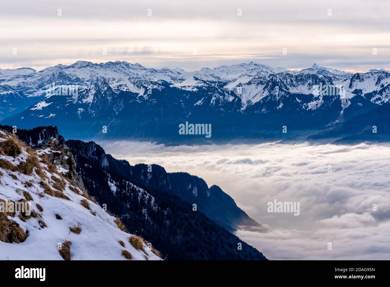 Alpine landscape with peaks covered by snow and clouds. Rochers de Naye ...