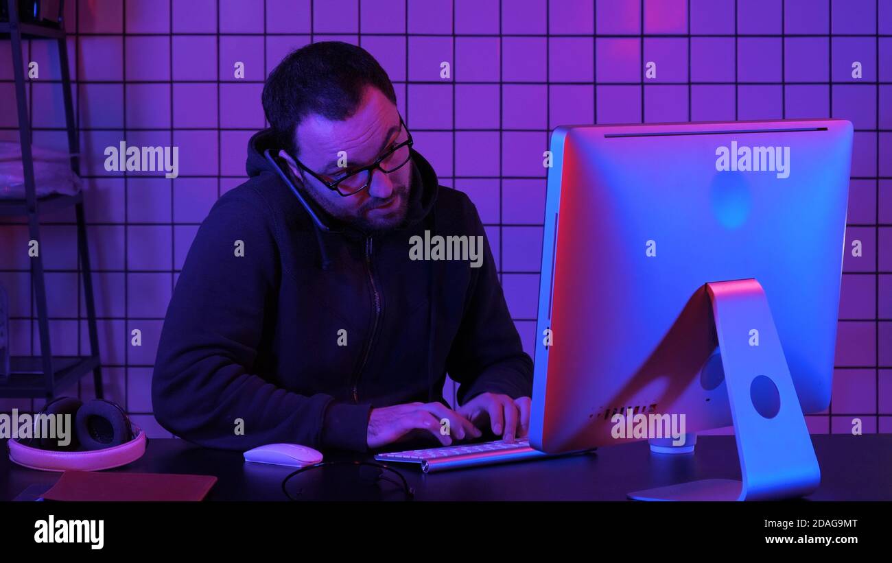 Professional hacker using mobile cell phone talking and spreadin Stock ...