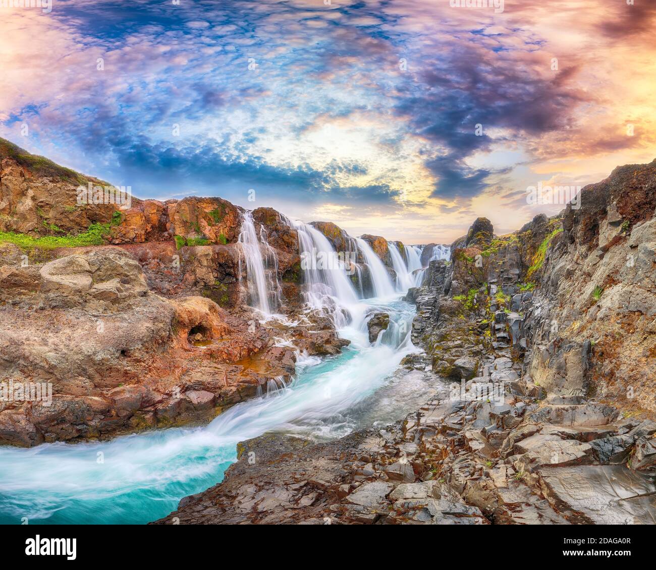 Breathtaking view of Kolufossar waterfall at sunset. Popular tourist ...