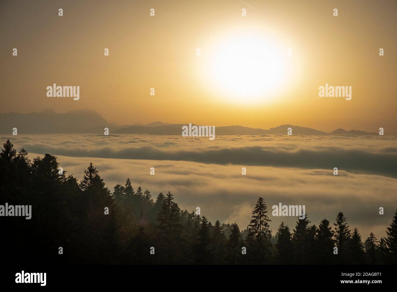 atmospheric sunset over the clouds Stock Photo - Alamy