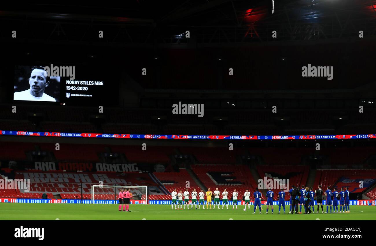 Players and officials take part in a minute's applause in memory of ...