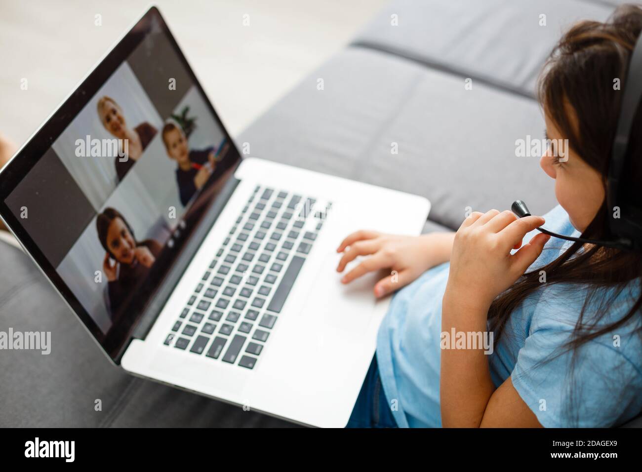Little girl studying homework math during her online lesson at home ...