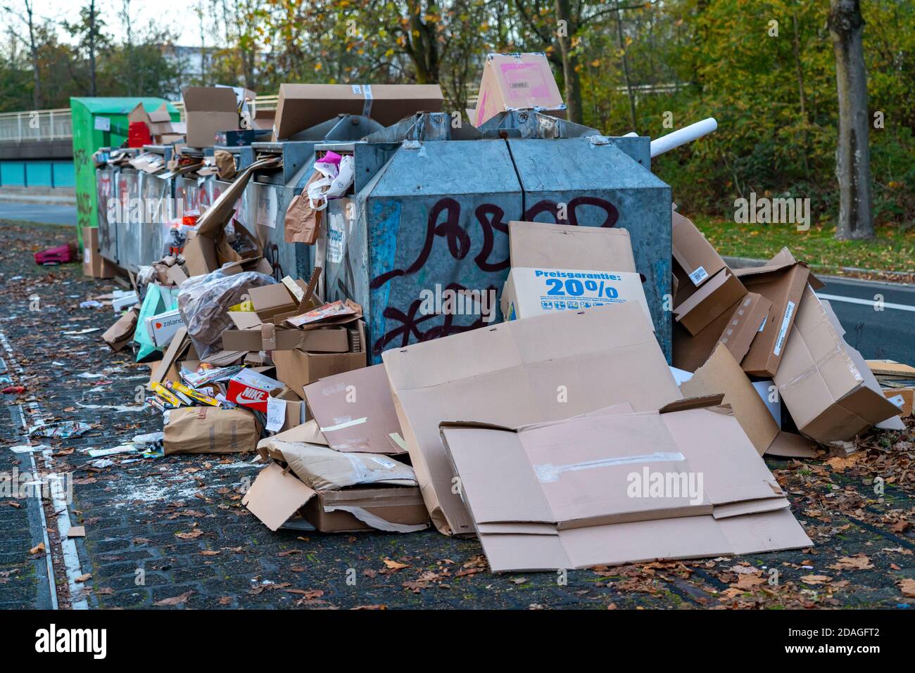Overfilled waste paper containers, despite overcrowding, people put ...