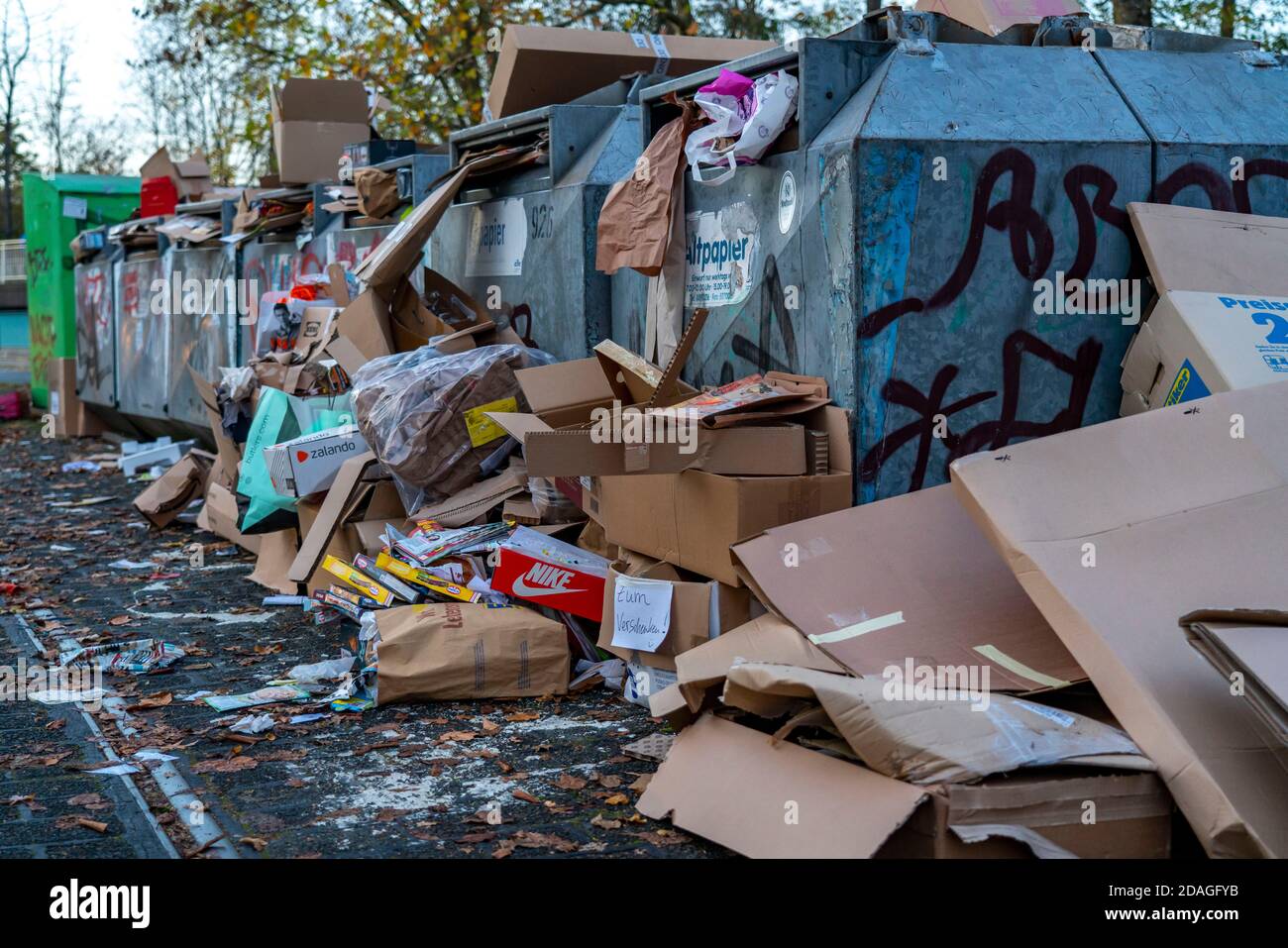 Overfilled waste paper containers, despite overcrowding, people put ...