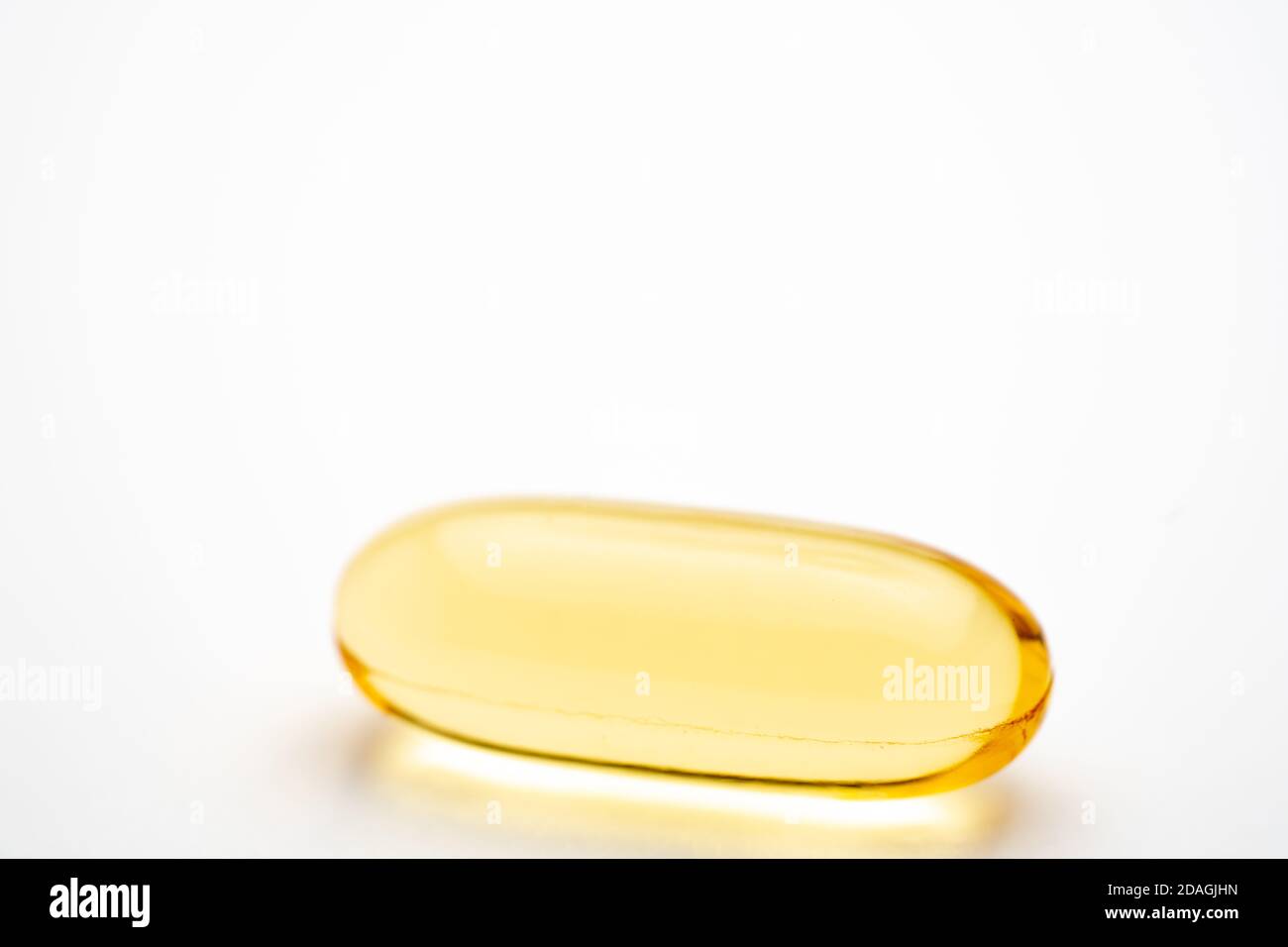 Fish Oil Pill macro photo isolated on white background Stock Photo - Alamy