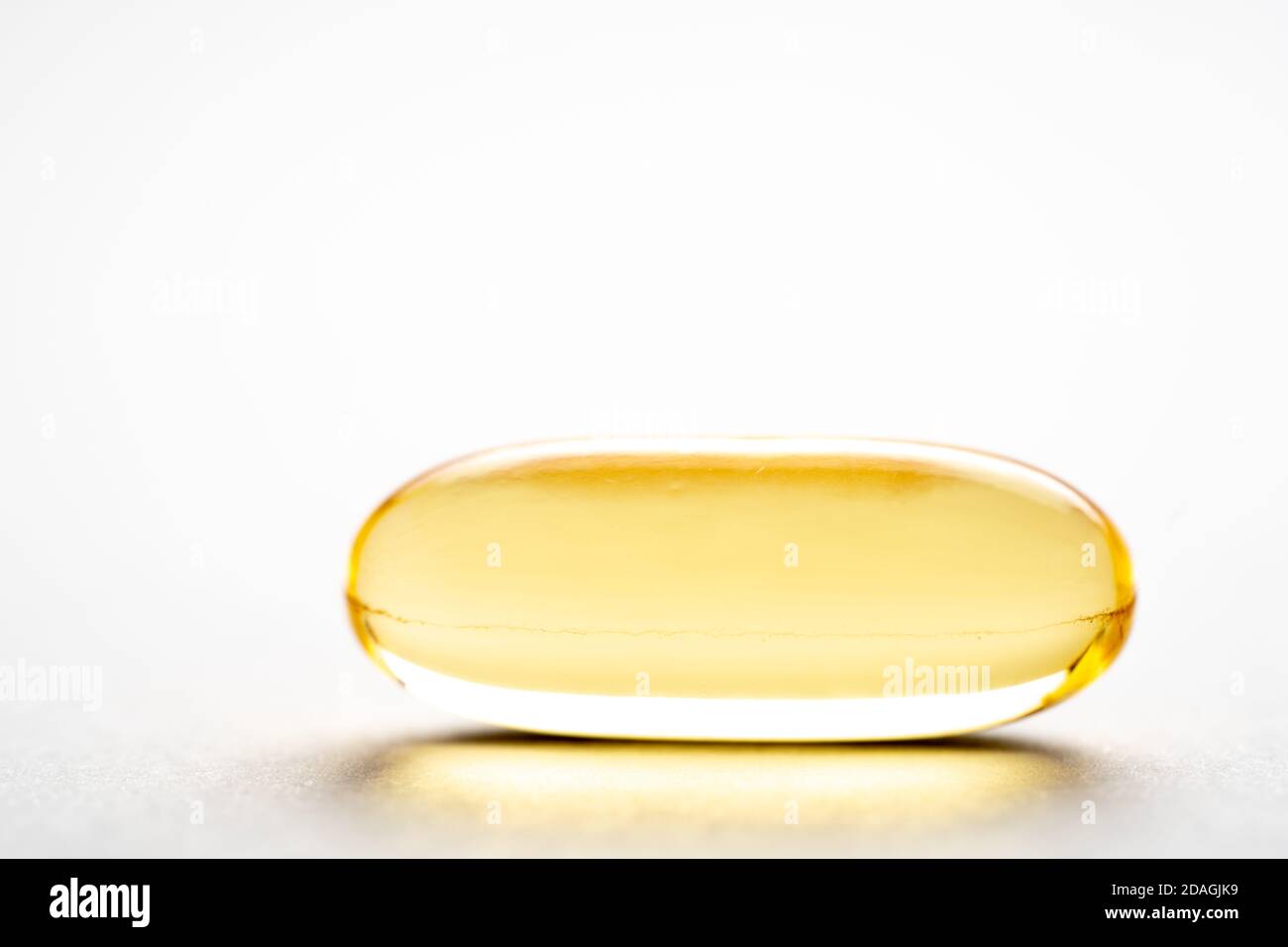 Fish Oil Pill macro photo isolated on white background Stock Photo - Alamy