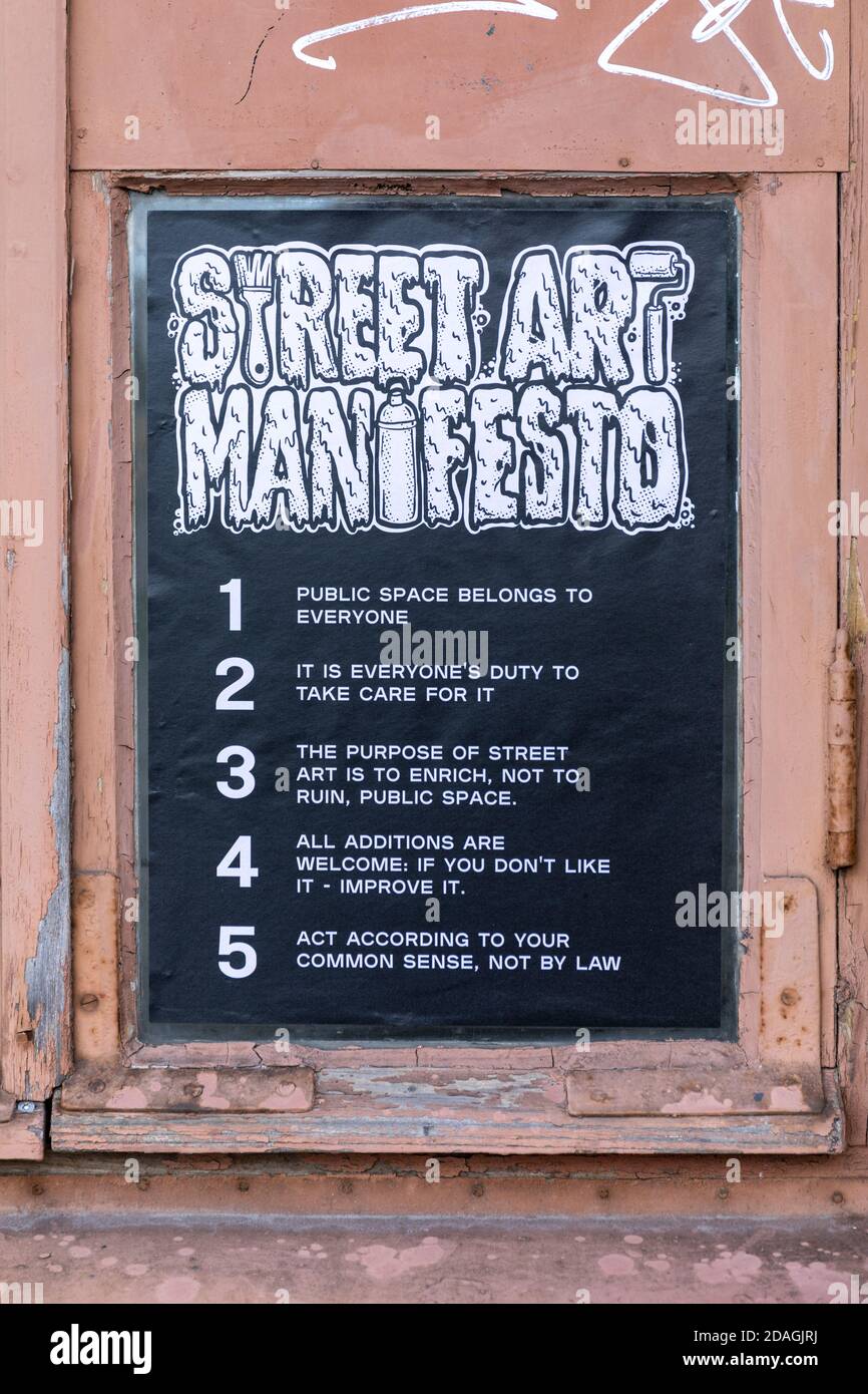 Street art manifesto sticker on a window in Helsinki, Finland Stock ...