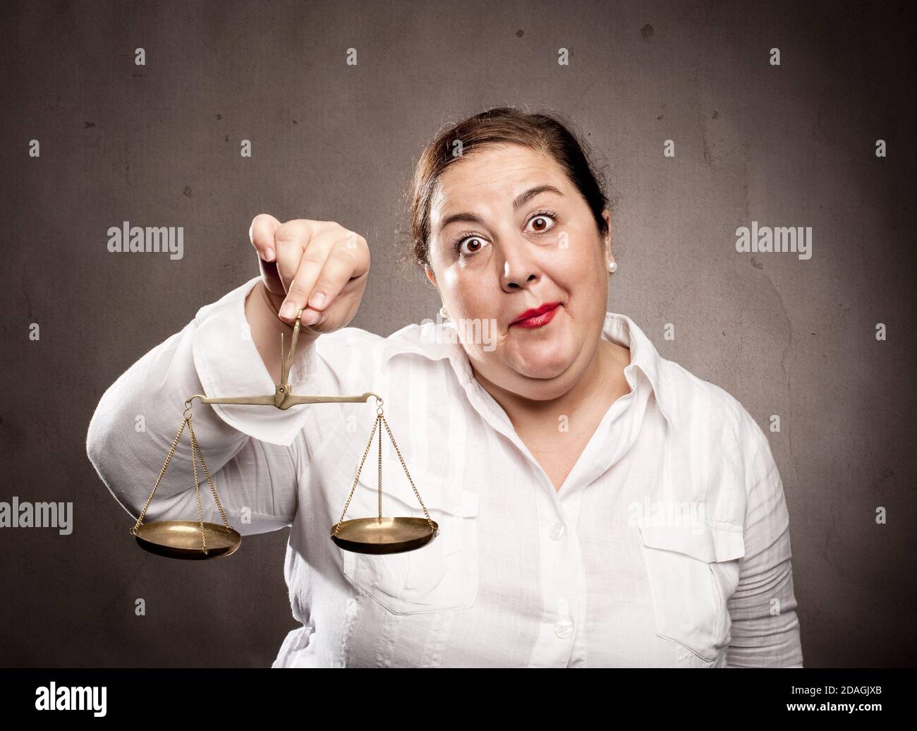 fat woman holding a scale Stock Photo - Alamy