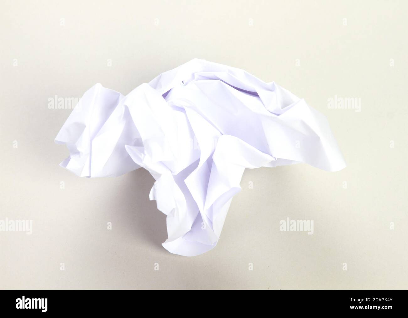 Crumpled piece of paper isolated on a white background Stock Photo - Alamy
