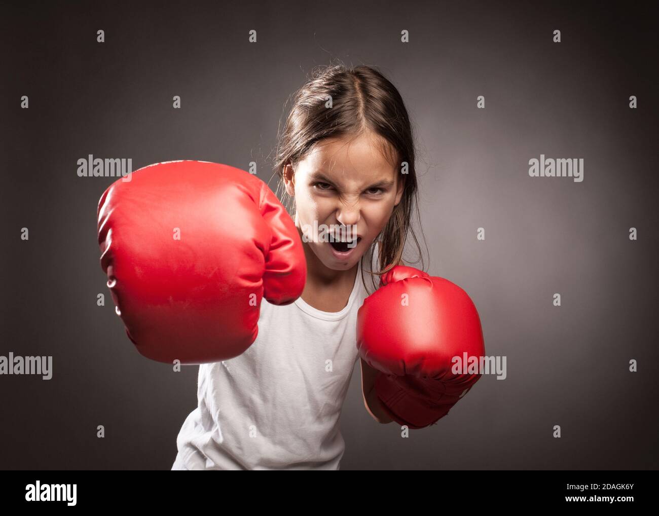 little girl wearing red boxing gloves Stock Photo - Alamy