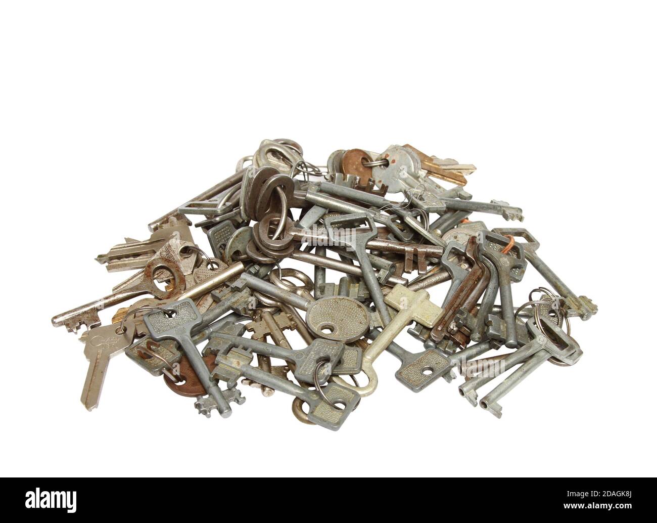 Pile of rusty silver keys on a white surface Stock Photo - Alamy