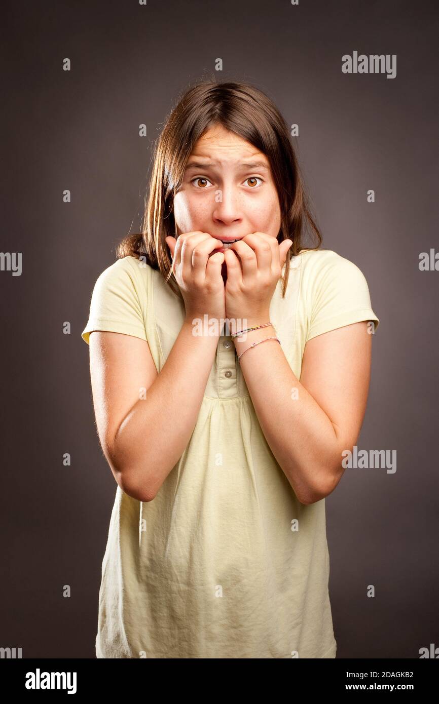 portrait of young girl scared Stock Photo - Alamy