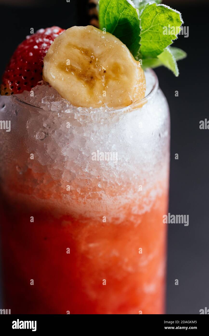 red strawberry alcoholic cocktail on a black background Stock Photo - Alamy