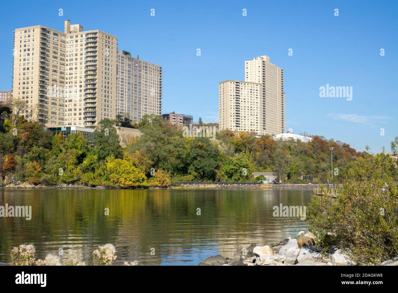 Apartment complex buildings with a view of creek and Inwood Hill Park ...