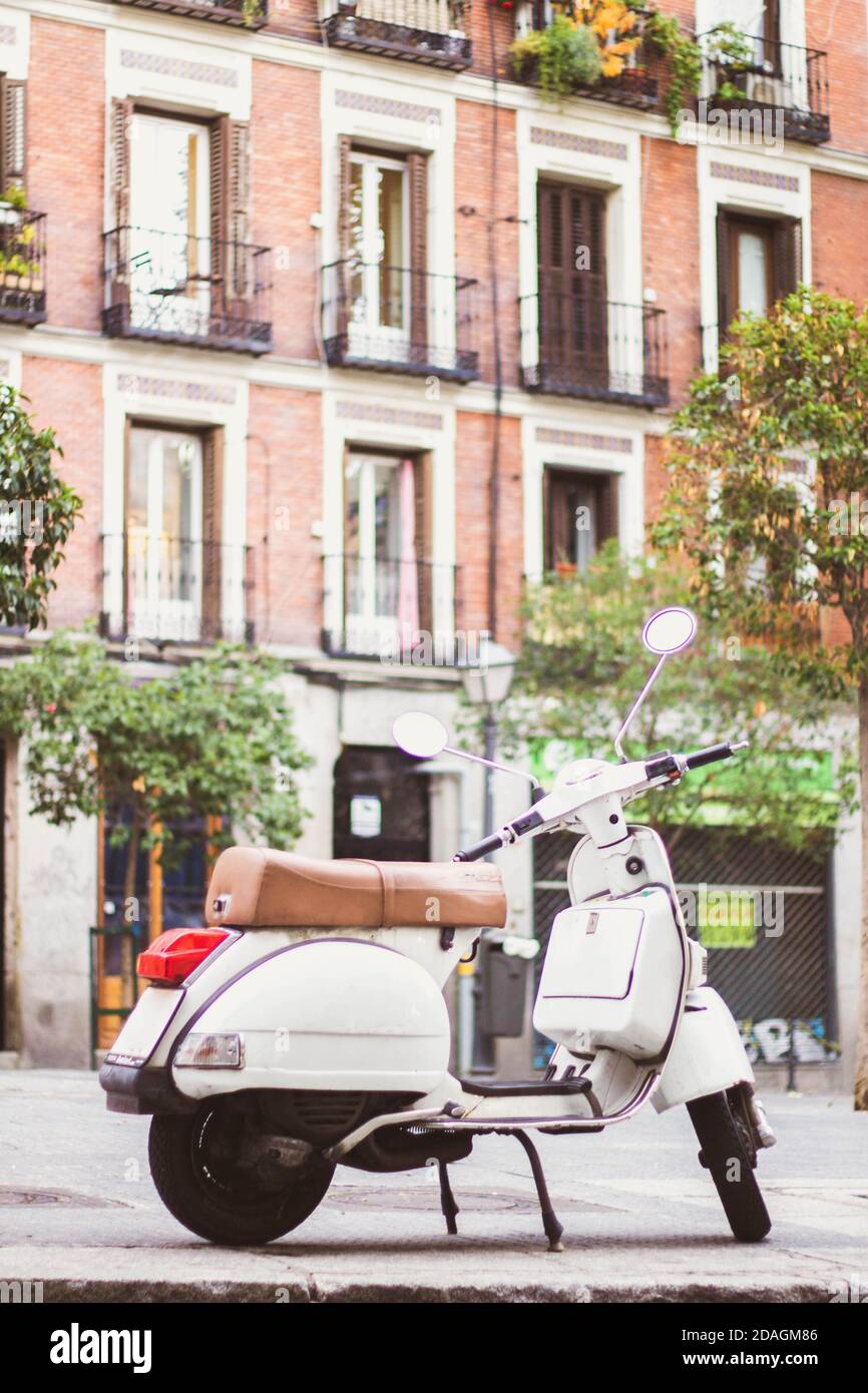 white motorcycle parked on the street Stock Photo - Alamy