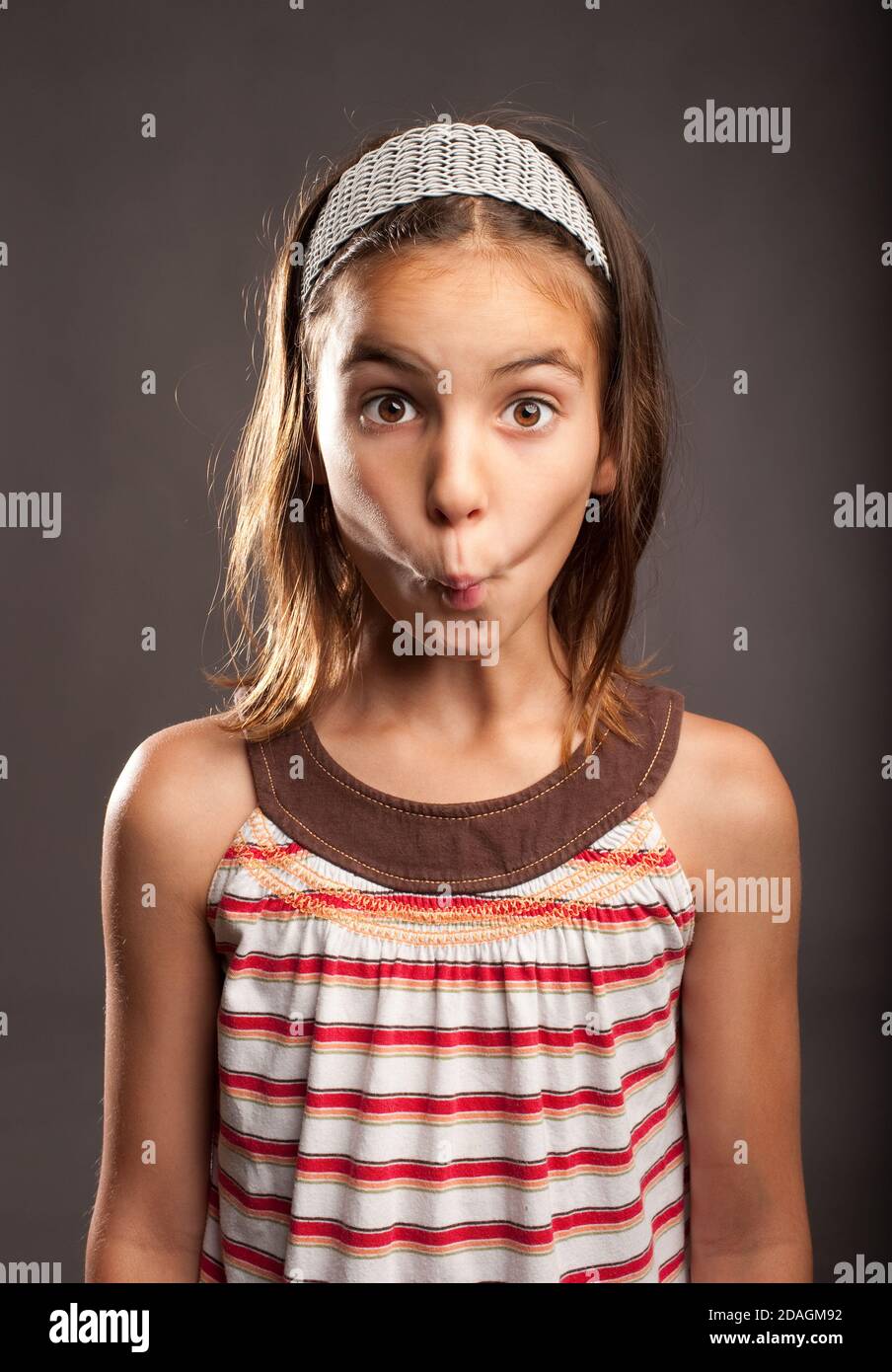 portrait of happy little girl with mouth like a fish Stock Photo - Alamy